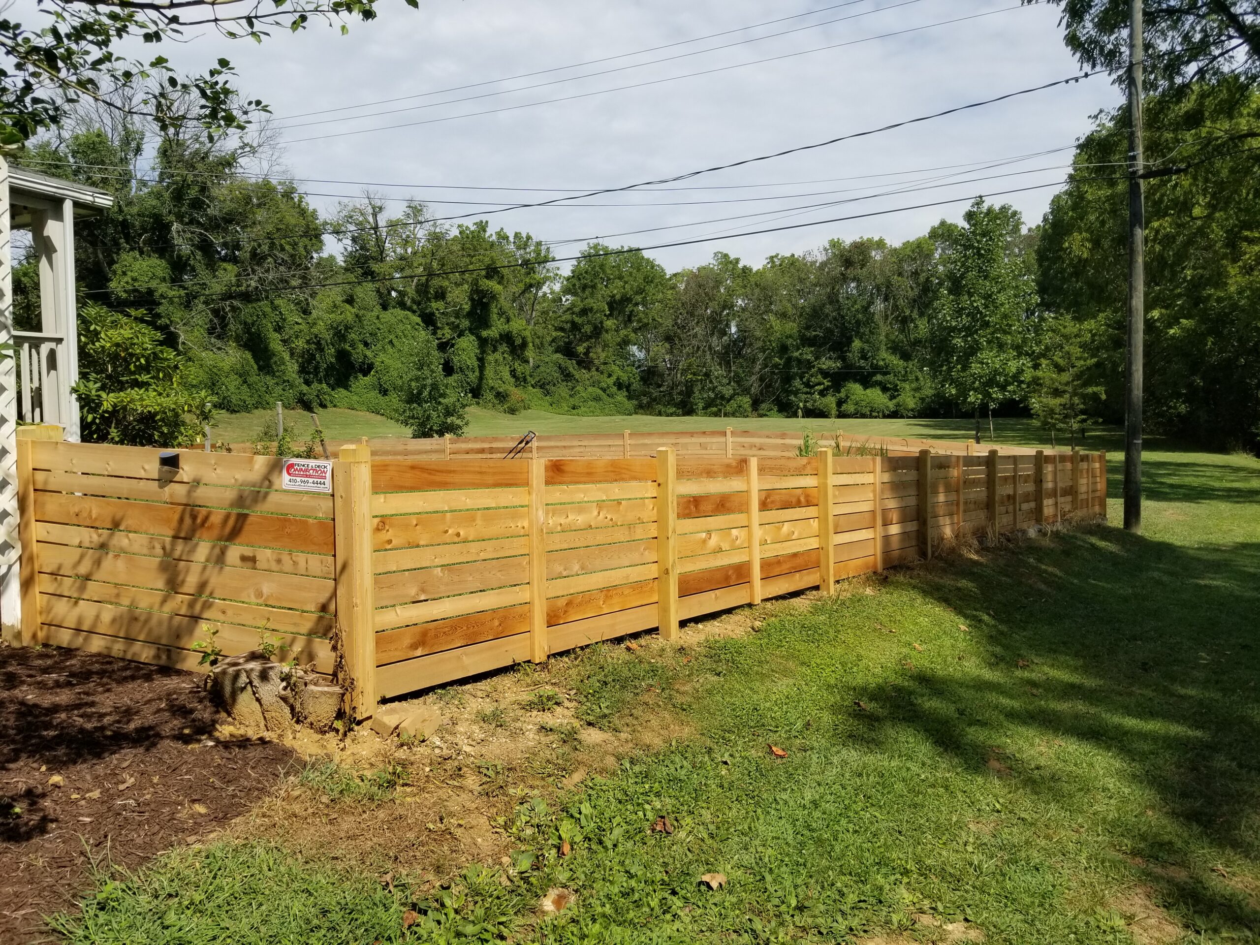Horizontal Wood Privacy Fence - Fence & Deck Connection